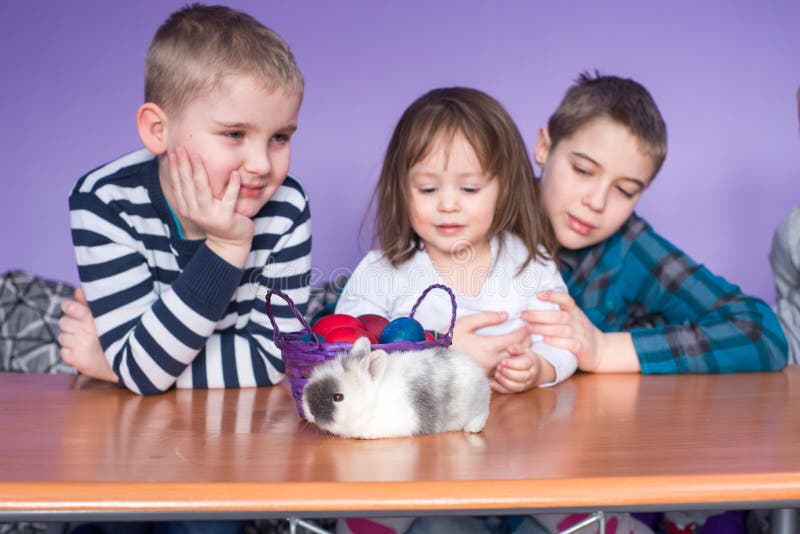 Children Playing with Easter Bunny Stock Photo - Image of green ...