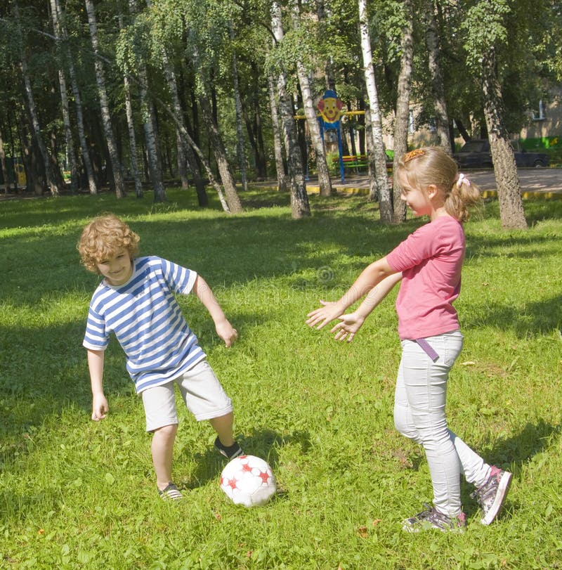 Children playing football stock image. Image of outdoors - 27660599