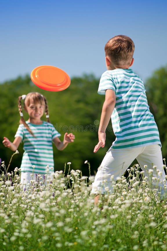 Children playing frisbee stock photo. Image of frisbee - 26800054