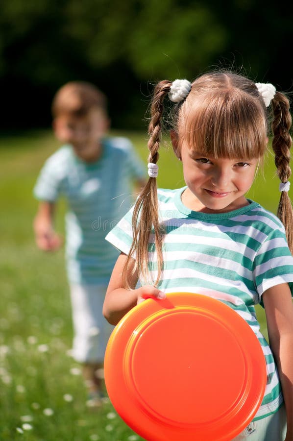 Children playing frisbee stock photo. Image of girl, lifestyle - 26800156