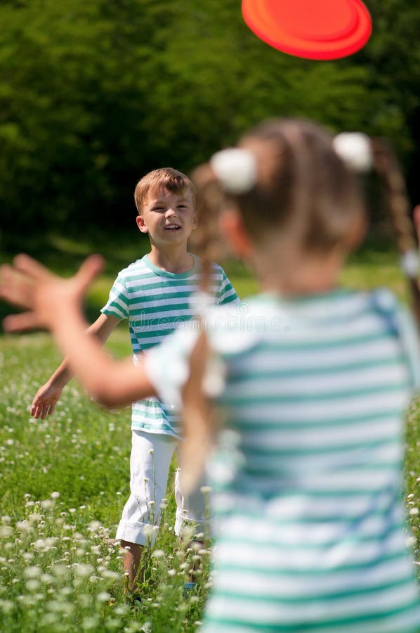 Children playing frisbee stock image. Image of happiness - 27177937