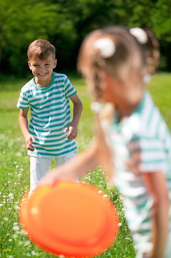 Children playing frisbee stock photo. Image of frisbee - 26800054
