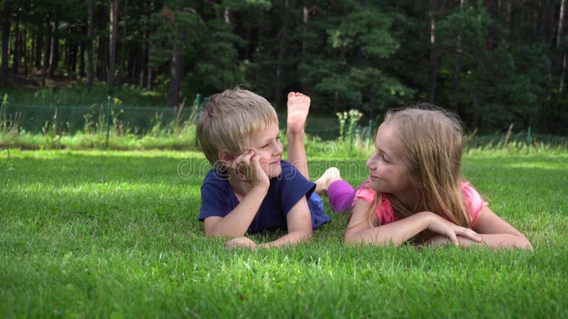 Children Playing on the Grass Stock Video - Video of field, girl: 75198377