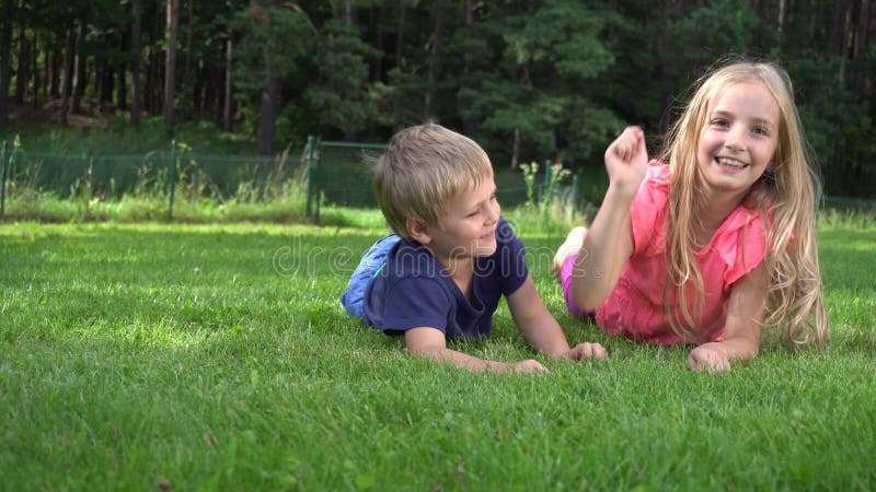 Children Playing on the Grass Stock Video - Video of happy, face: 75198603