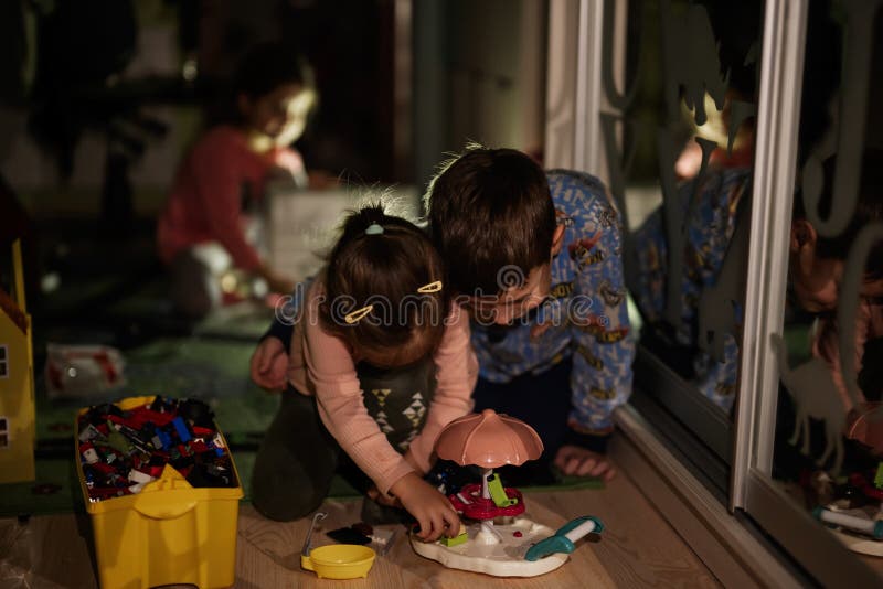 Children Playing at Home during a Blackout Using Alternative Lighting ...