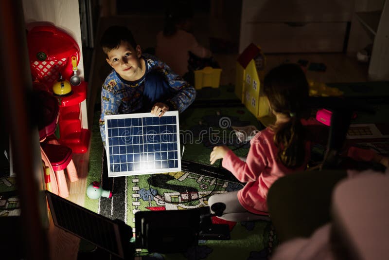 Children Playing at Home during a Blackout Using Alternative Lighting ...