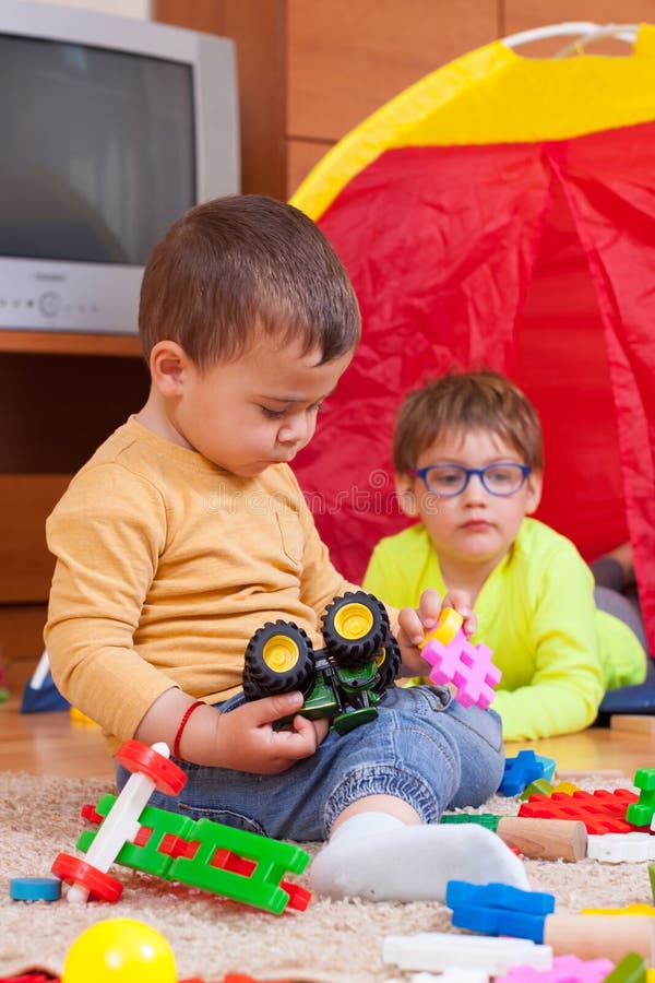Young Children Sitting on Beach Stock Image - Image of ball, months ...
