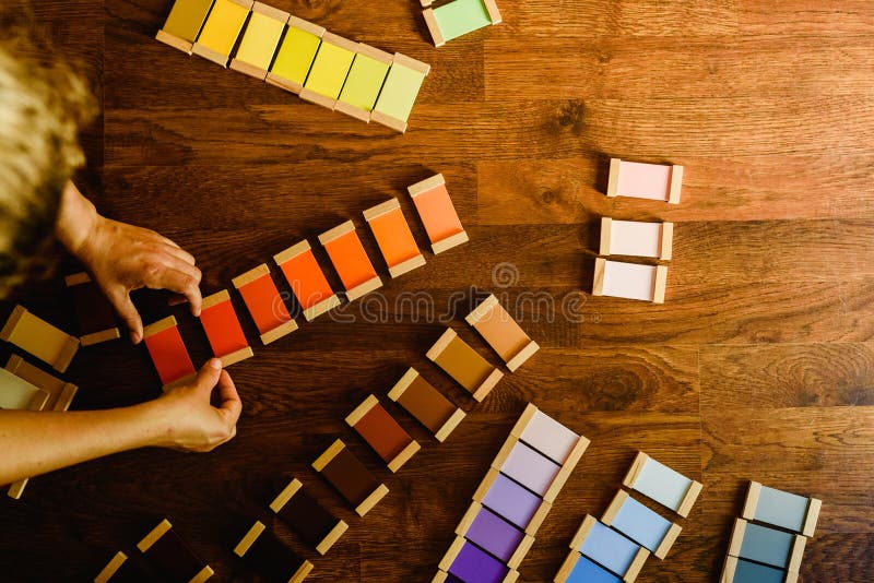 Children Playing and Learning with Montessori Color Tablets Stock Image ...