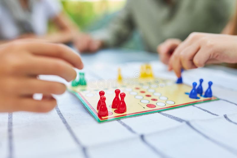 Children Playing Ludo with Token on Table in Summer Stock Photo - Image ...