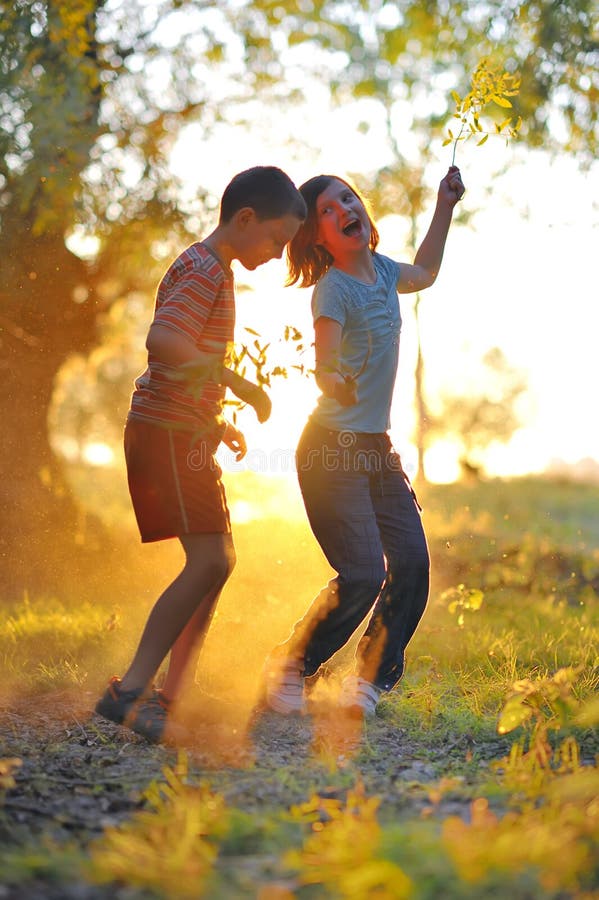 Children playing on meadow stock image. Image of field - 24923589