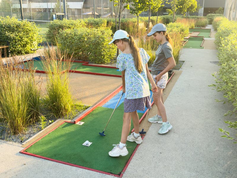 Children Playing Mini Golf. Child Golfer Stock Photo - Image of game ...