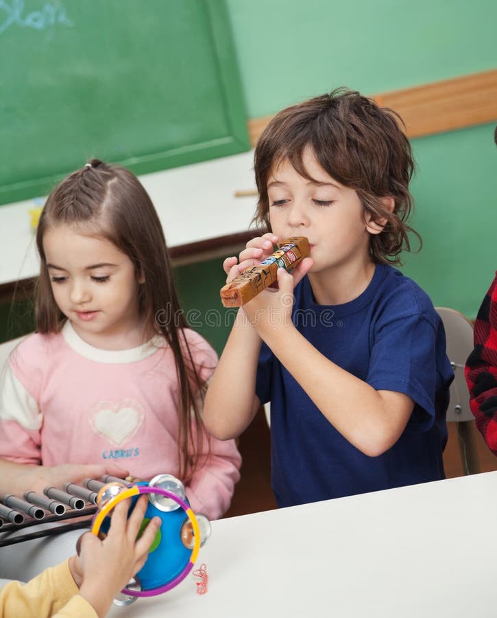 Children Playing Musical Instruments in Classroom Stock Photo - Image ...
