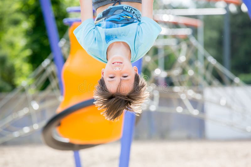 Children, Playing on a Playground, Hanging in Big Circles on a Climbing ...