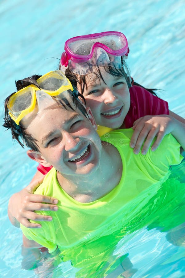 Children playing in pool stock photo. Image of details - 20340504