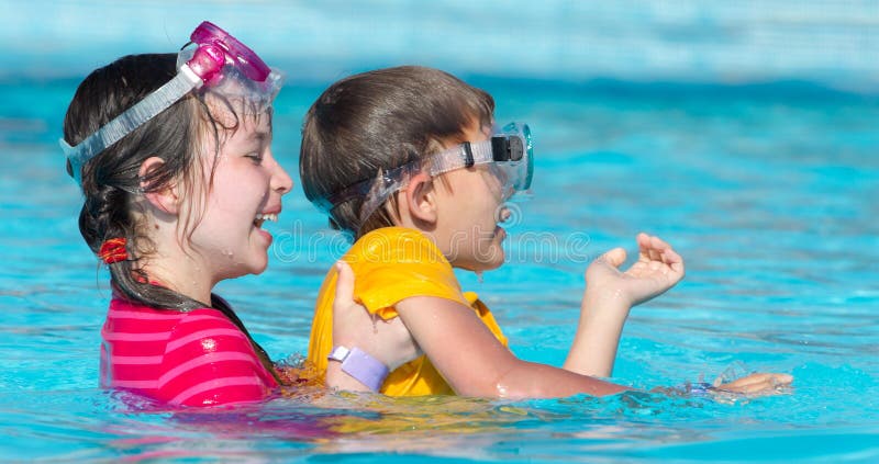 Children playing in pool stock photo. Image of blue, activity - 20340938