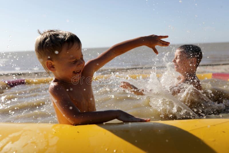 Children playing in pool stock image. Image of happy - 126936861