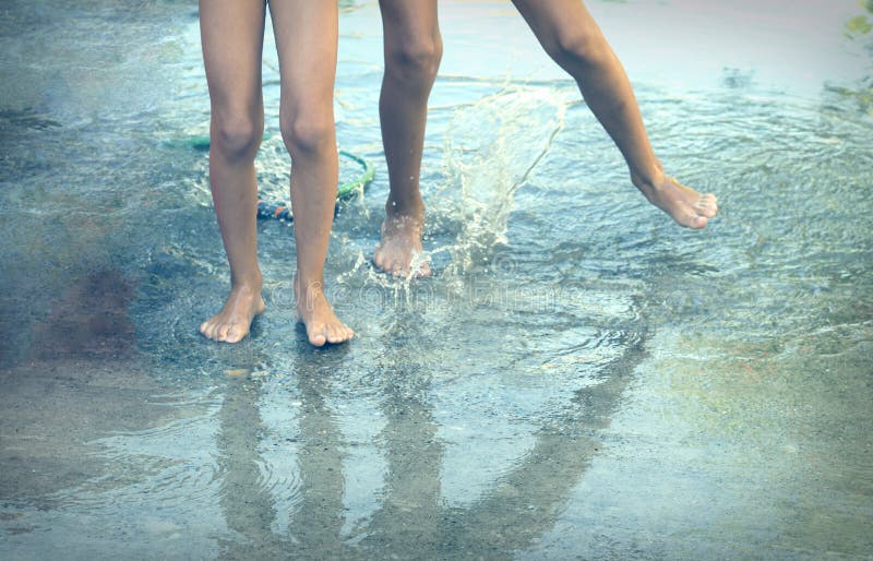 Children Playing in the Puddle Stock Image - Image of body, legs: 57937463