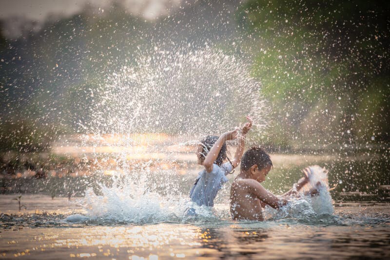 Children Playing in Waterfall Stock Photo - Image of happy, beach: 22410374