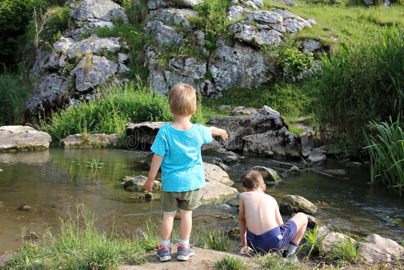 Children Playing in a River Stock Photo - Image of mountains, child ...