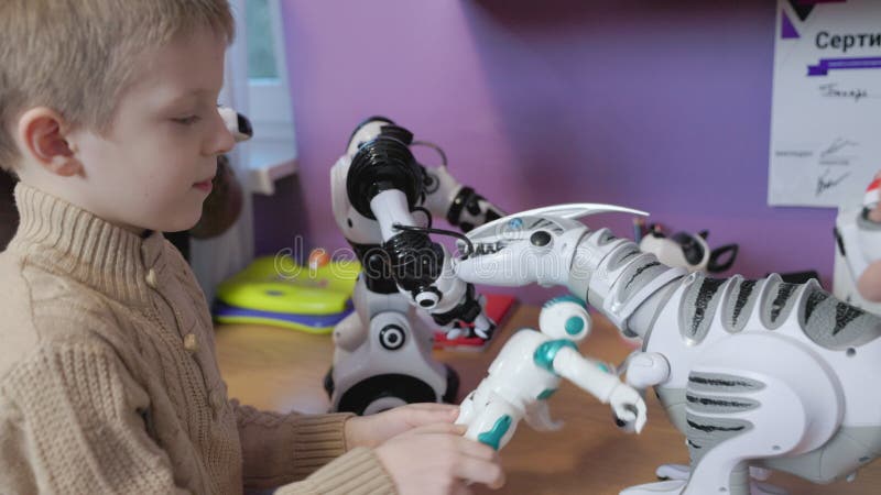 Kids playing with robots stock footage. Video of robot - 241221880