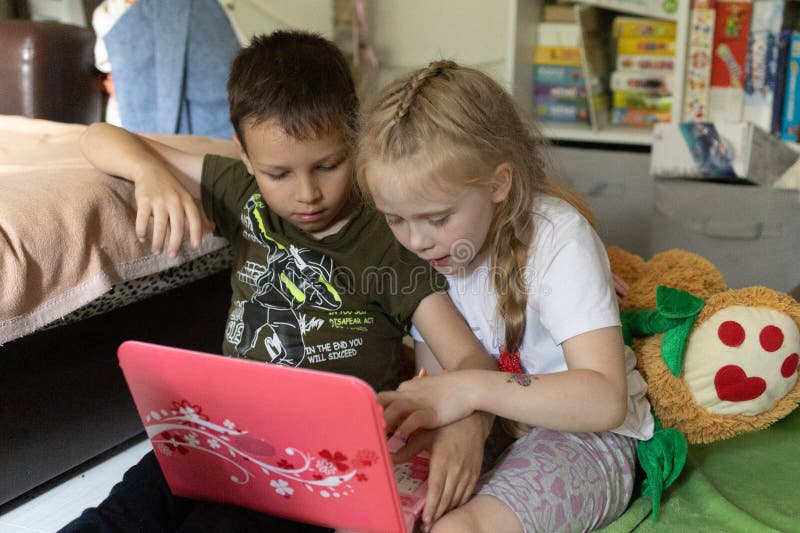 Children Playing at a Children S Laptop in a Children S Room. Teaching ...