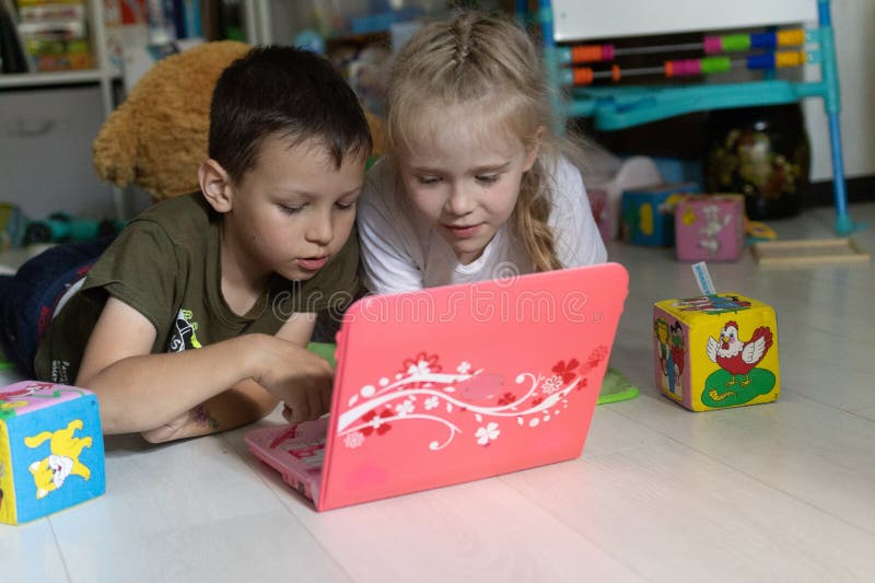 Children Playing at a Children S Laptop in a Children S Room. Teaching ...