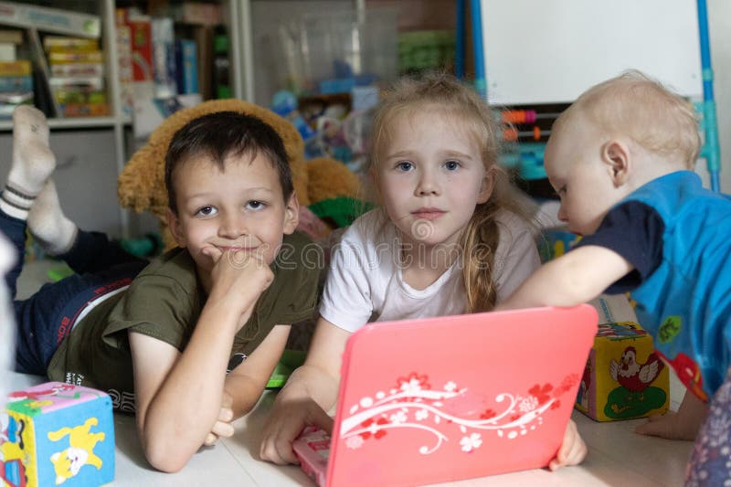 Children Playing at a Children S Laptop in a Children S Room. Teaching ...
