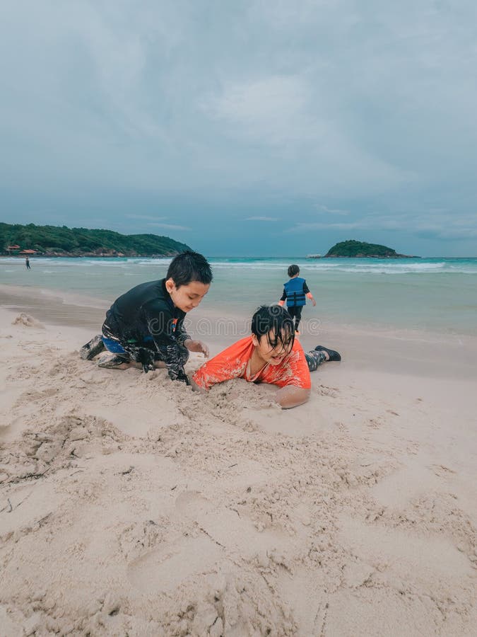 Children Playing Sand at the Beach Together Stock Photo - Image of ...