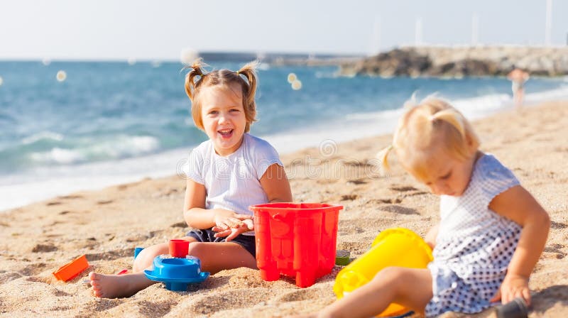 Children playing with sand stock image. Image of vacation - 44829709