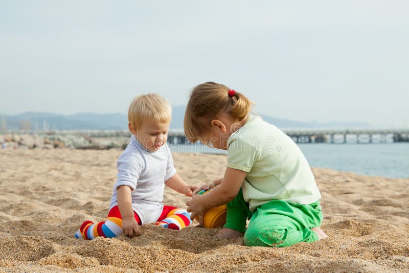 Children playing with sand stock image. Image of babies - 38943139