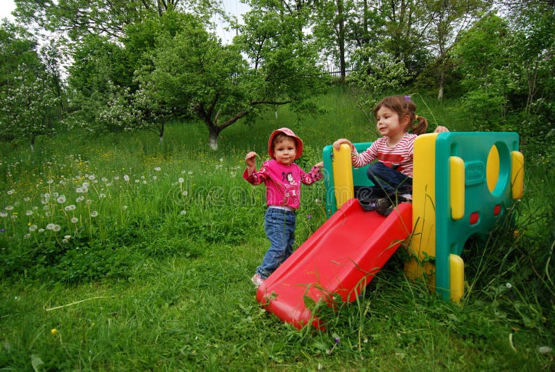 Children playing on slide stock image. Image of happy - 5307743