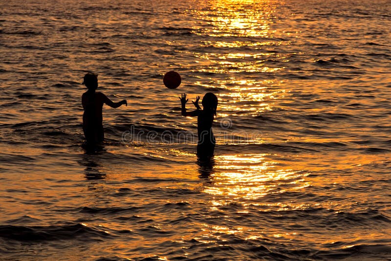 Children playing at sunset stock photo. Image of poetry - 40742948
