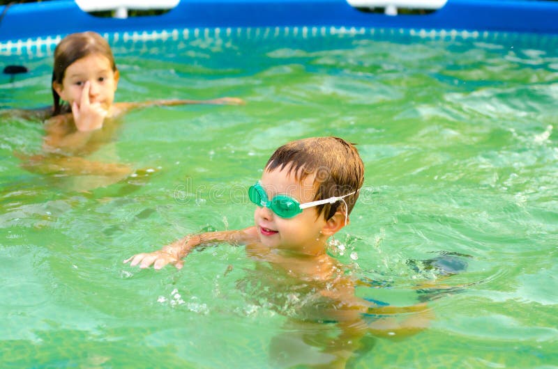 Children Playing in the Swimming Pool Stock Image - Image of female ...