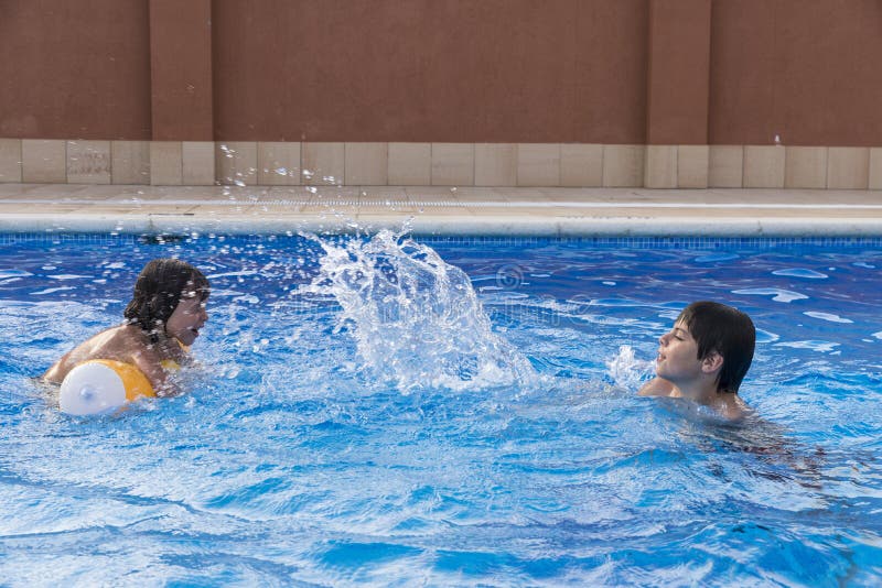 Children Playing in a Swimming Pool Stock Photo - Image of outdoors ...