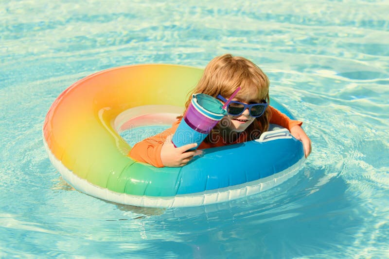Children Playing in the Swimming Pool. Kid Summer Vacation. Stock Photo ...