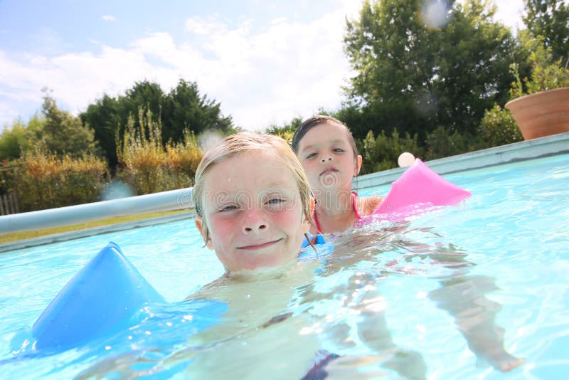 Children Playing in Swimming Pool Stock Photo - Image of kids, swimming ...