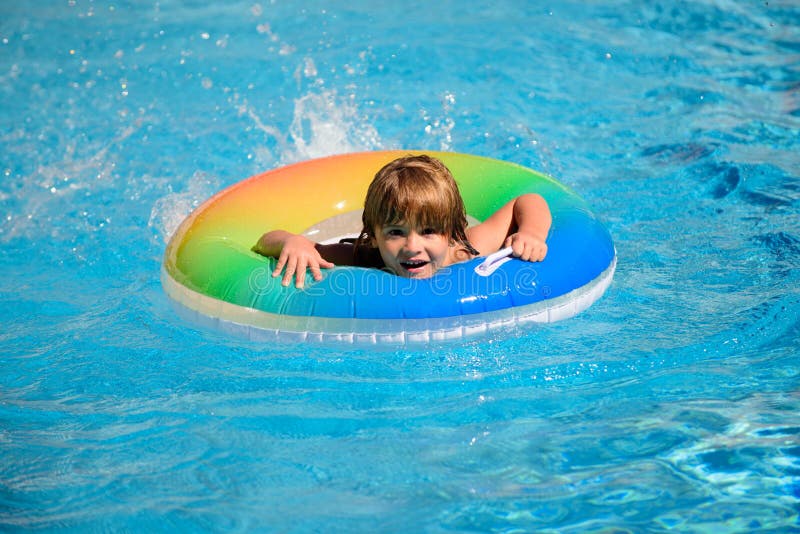Children Playing in the Swimming Pool. Summer Activity. Stock Photo ...