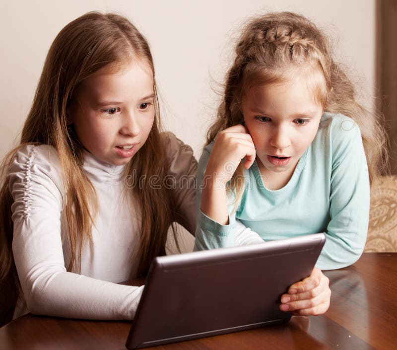 Children playing on tablet stock image. Image of girl - 28844473