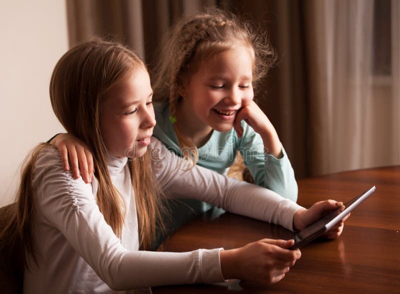 Children playing on tablet stock photo. Image of contemporary - 28844488