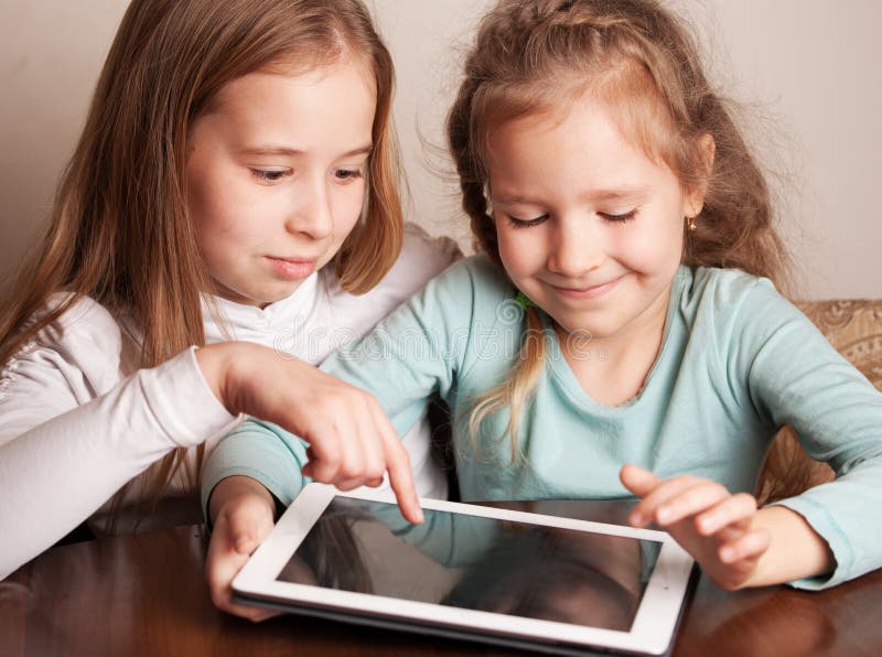 Kid playing Tablet stock image. Image of asia, learning - 27599585