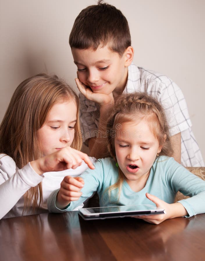 Two Girls Playing on Tablet and Phone Stock Image - Image of internet ...