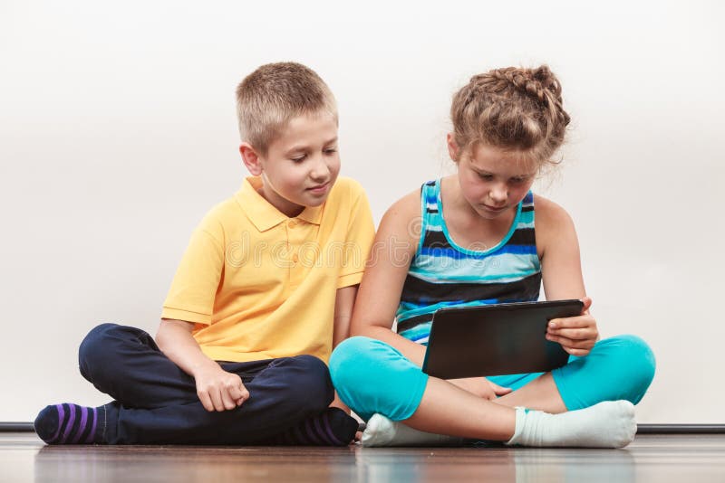 Children Playing on Tablet. Stock Photo - Image of showing, creative ...