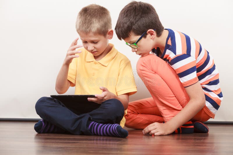Children Playing on Tablet. Stock Photo - Image of wireless, happiness ...