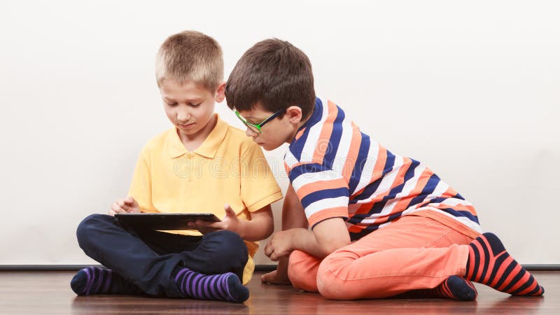 Children Playing on Tablet. Stock Photo - Image of tablet, technology ...