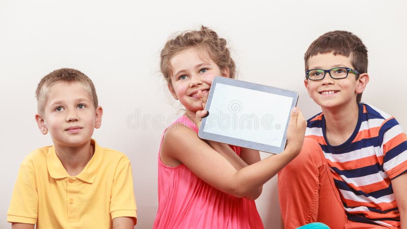 Children Playing on Tablet. Stock Image - Image of tablet, children ...