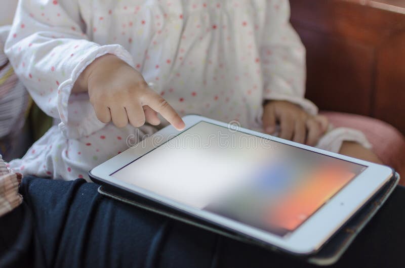Children playing on tablet stock photo. Image of child - 48329752