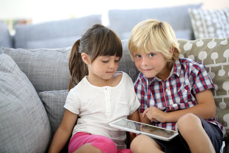 Children Playing on Tablet at Home Stock Image - Image of children ...