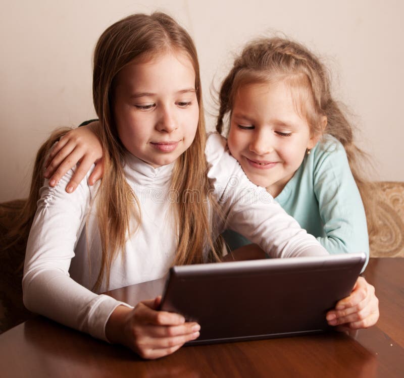 Children playing on tablet stock photo. Image of contemporary - 28844488
