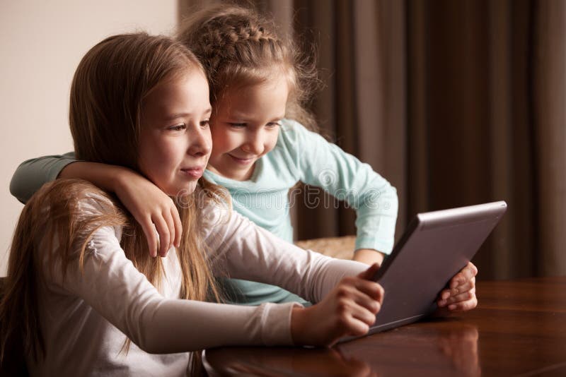Children playing on tablet stock image. Image of hand - 155106067