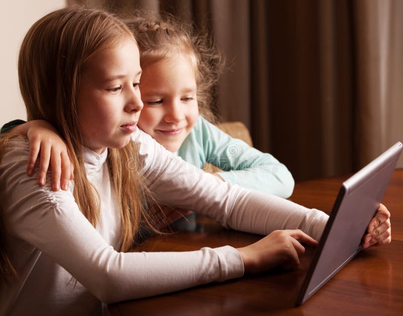 Children playing on tablet stock photo. Image of human - 29996208
